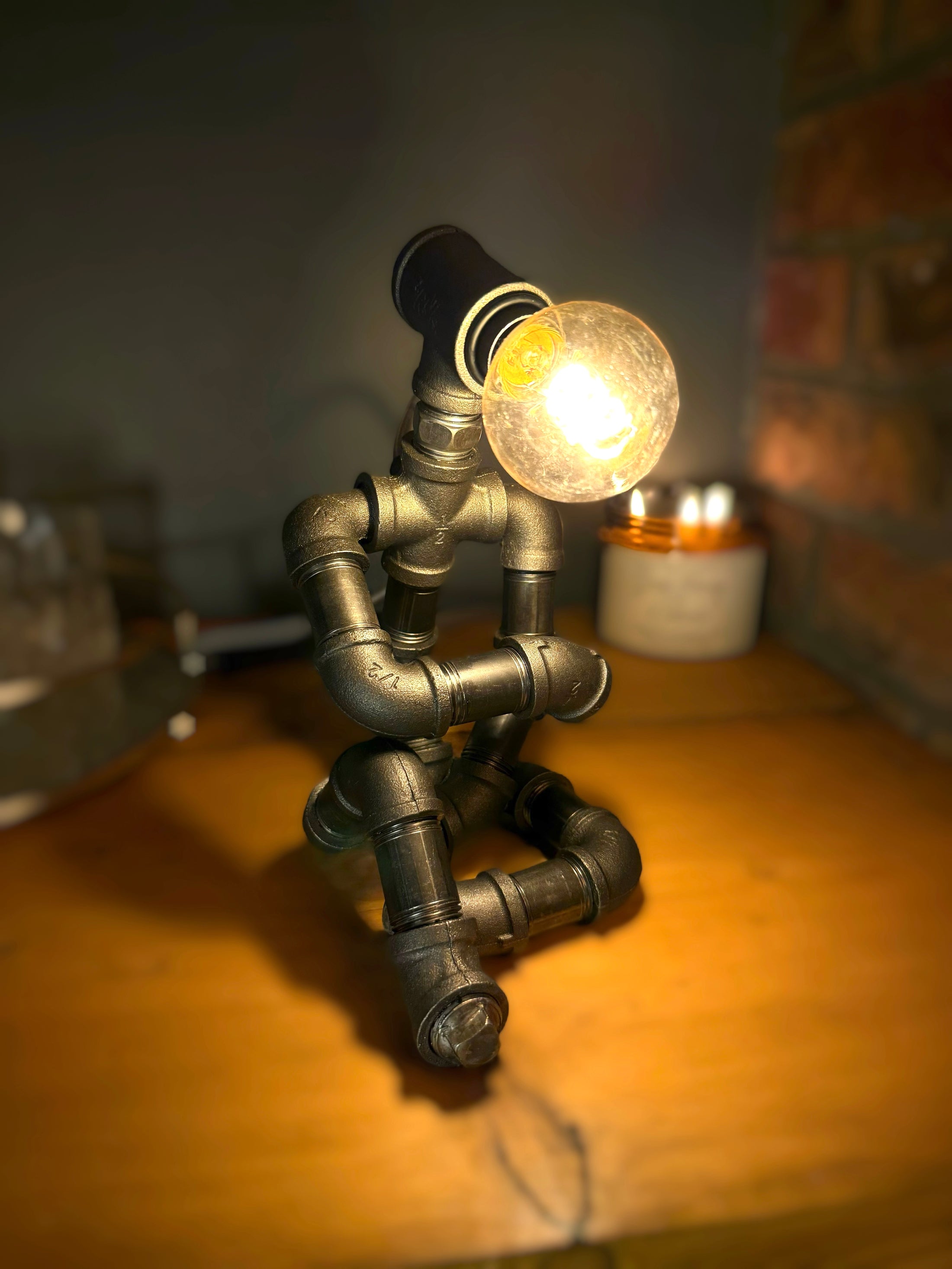 The Thinking Man Industrial Style Iron Pipe Person Lamp & Vintage Bulb ...