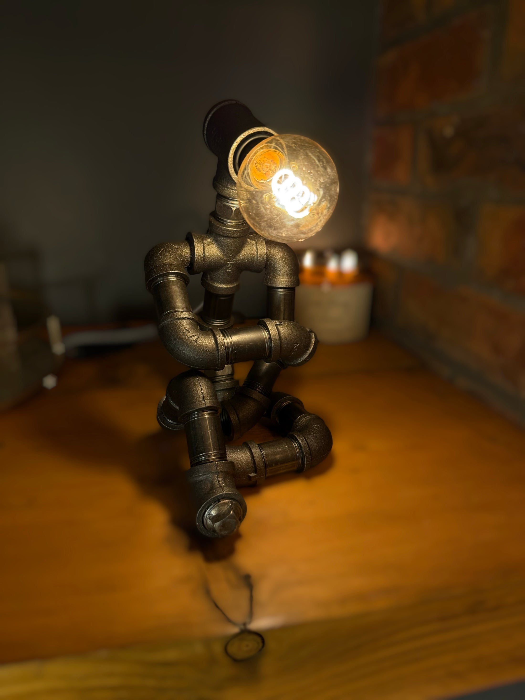 The Thinking Man Industrial Style Iron Pipe Person Lamp & Vintage Bulb ...