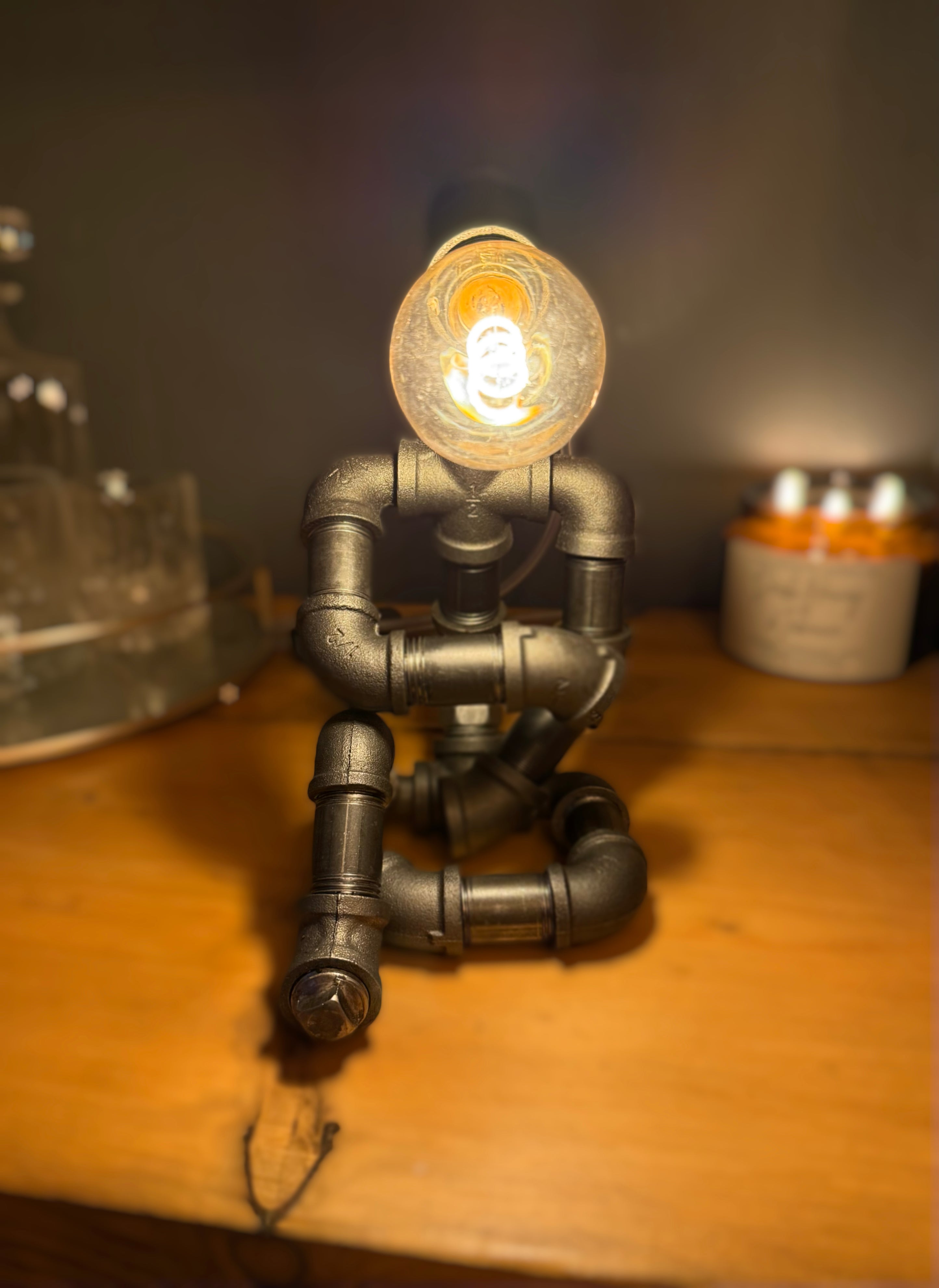 The Thinking Man Industrial Style Iron Pipe Person Lamp & Vintage Bulb ...