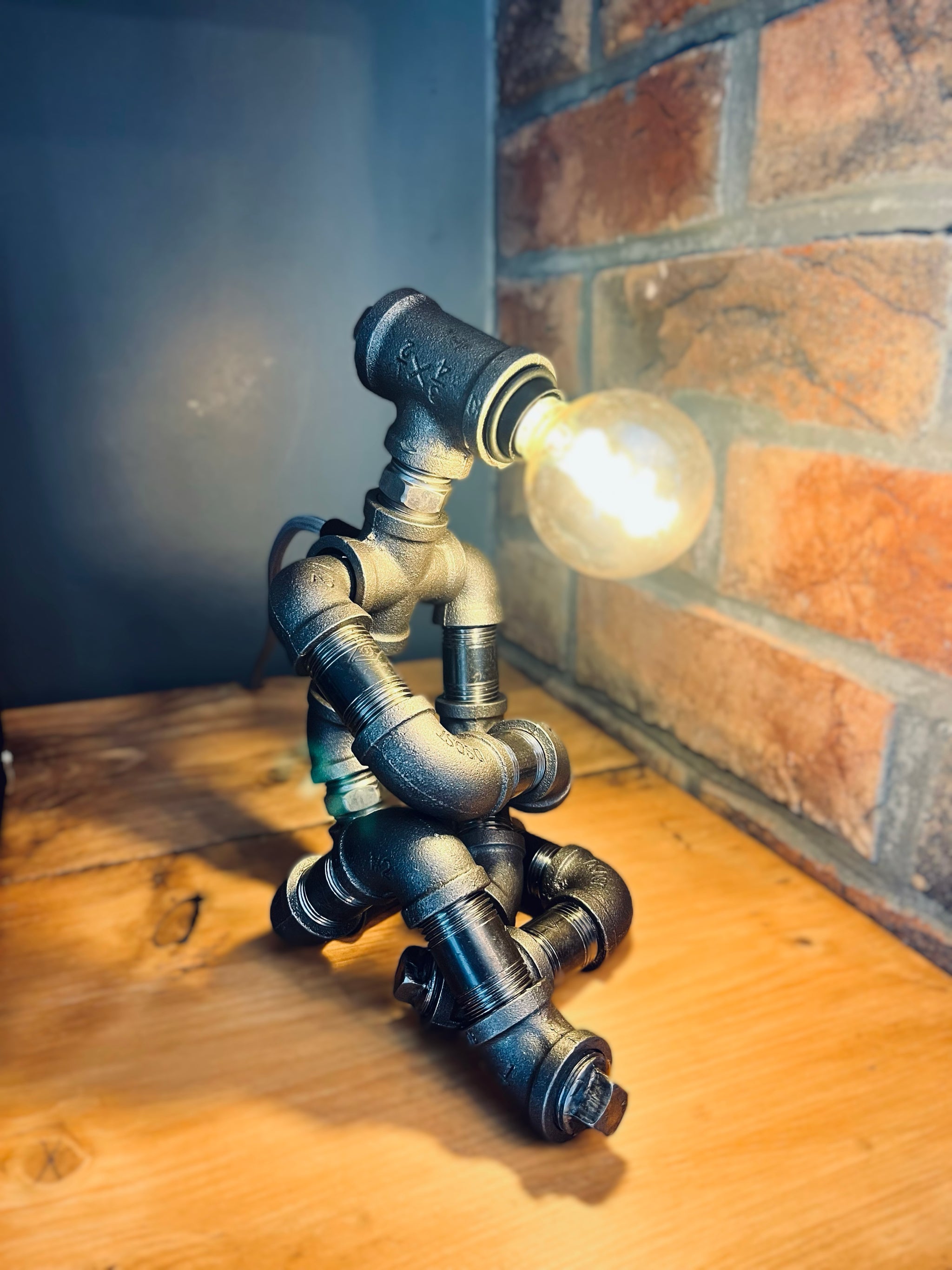The Thinking Man Industrial Style Iron Pipe Person Lamp & Vintage Bulb ...