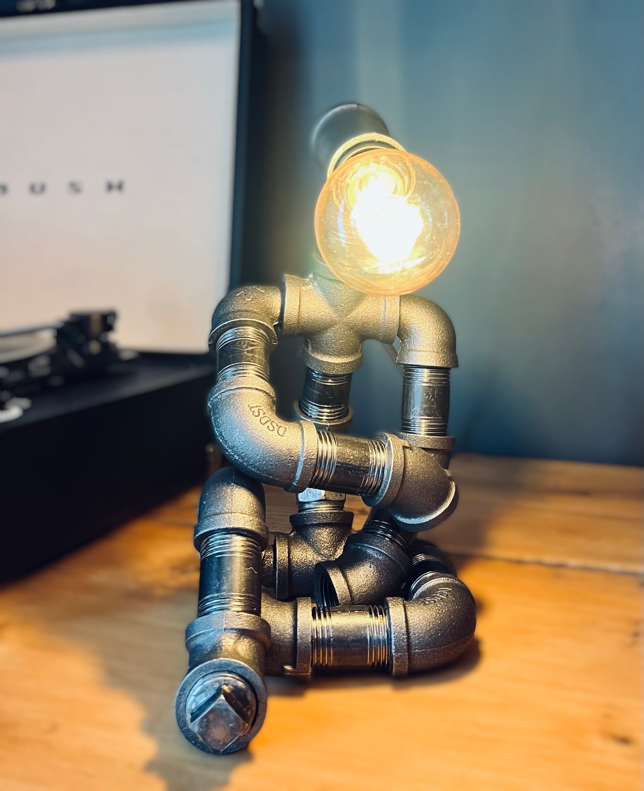 The Thinking Man Industrial Style Iron Pipe Person Lamp & Vintage Bulb ...
