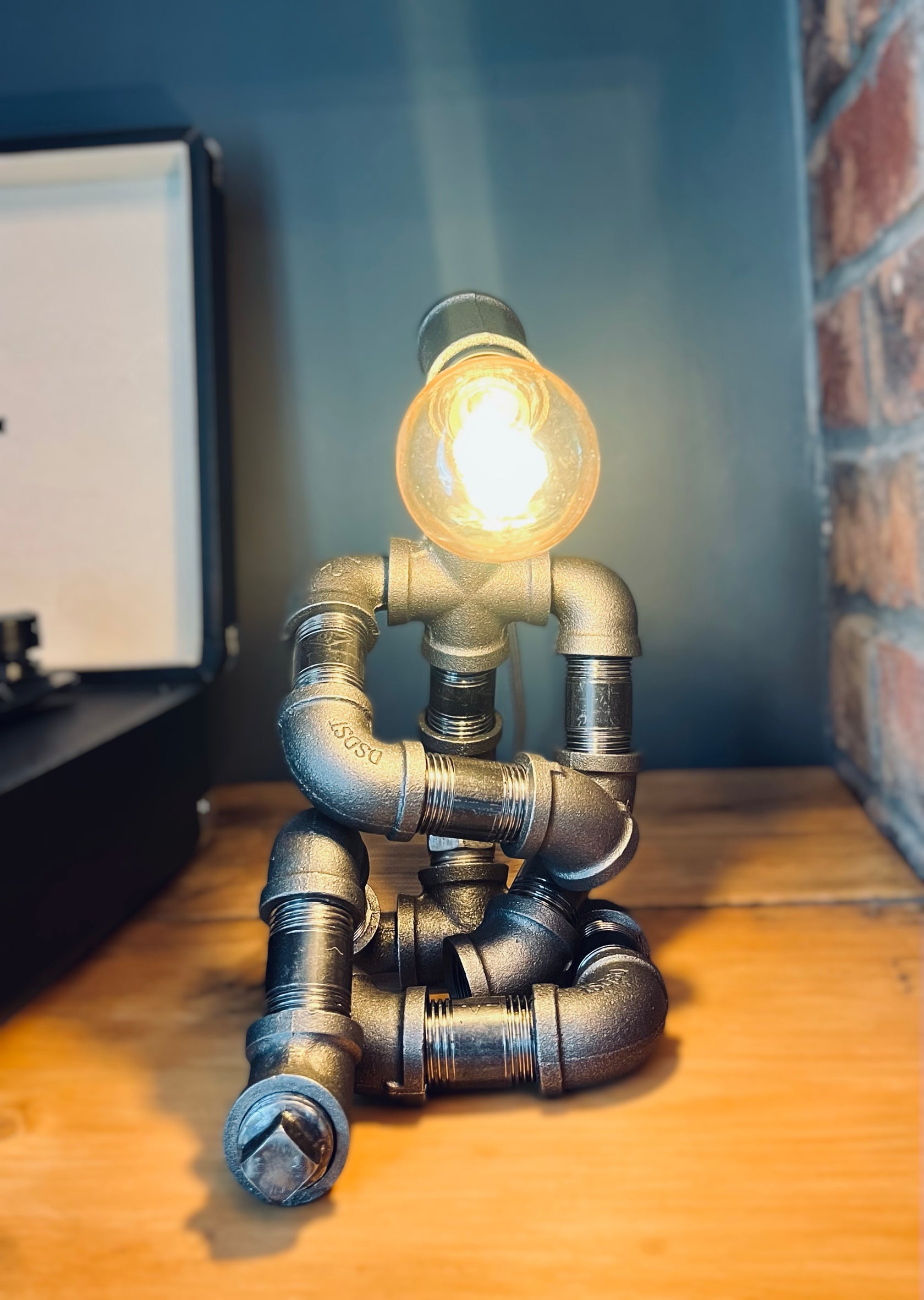 The Thinking Man Industrial Style Iron Pipe Person Lamp & Vintage Bulb ...