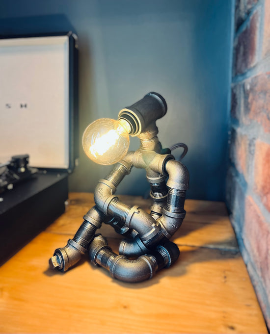 The Thinking Man Industrial Style Iron Pipe Person Lamp & Vintage Bulb ...