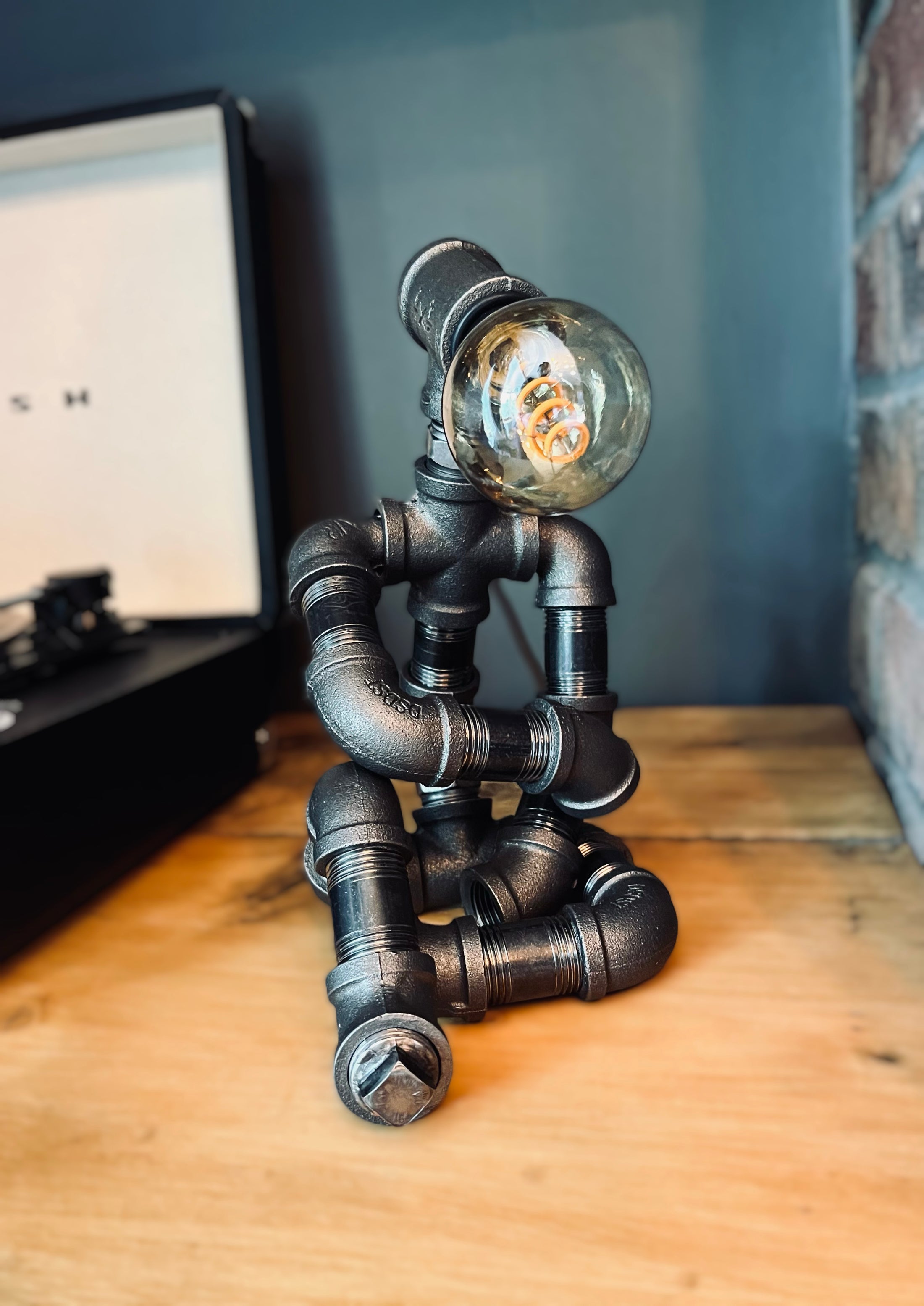 The Thinking Man Industrial Style Iron Pipe Person Lamp & Vintage Bulb ...