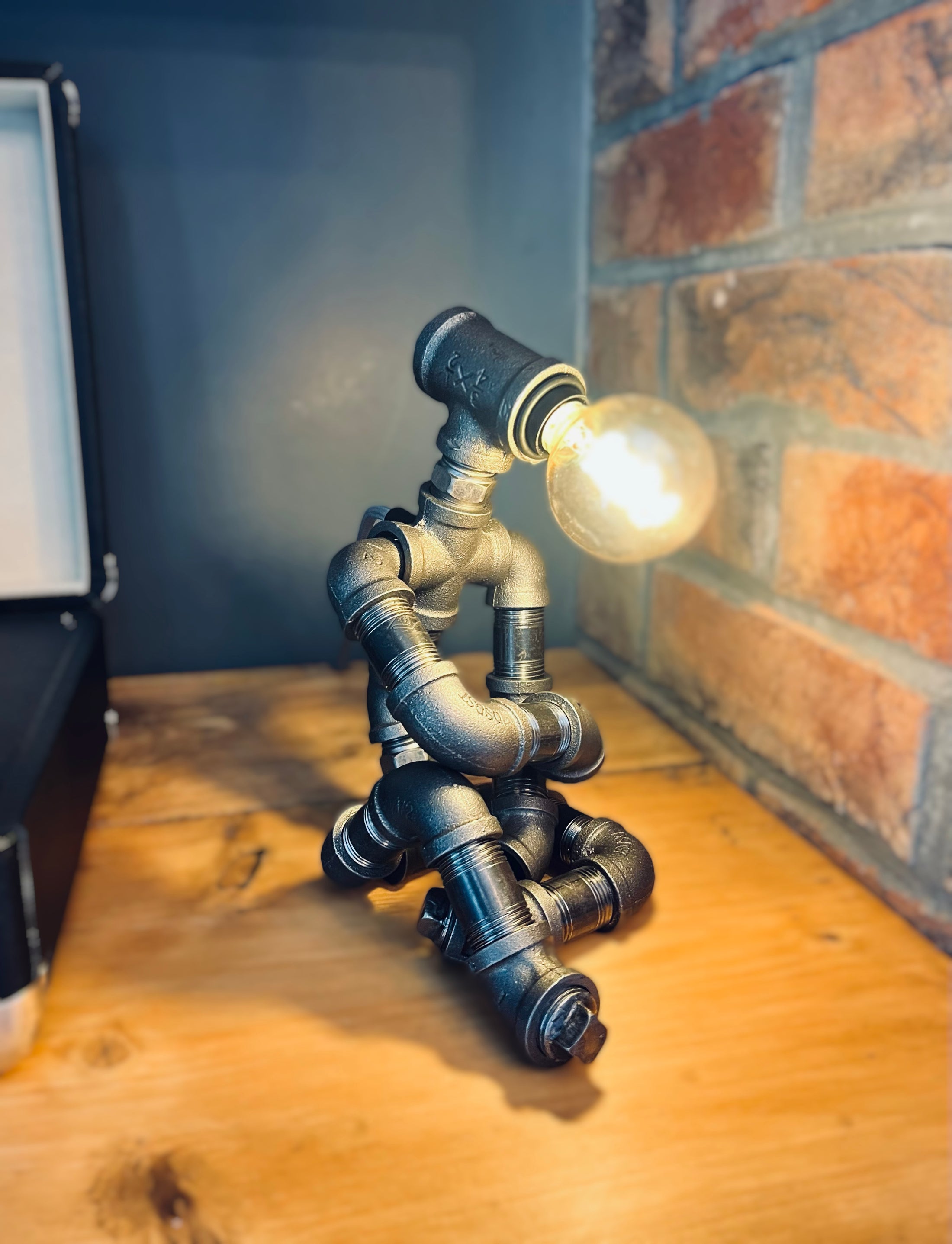 The Thinking Man Industrial Style Iron Pipe Person Lamp & Vintage Bulb ...