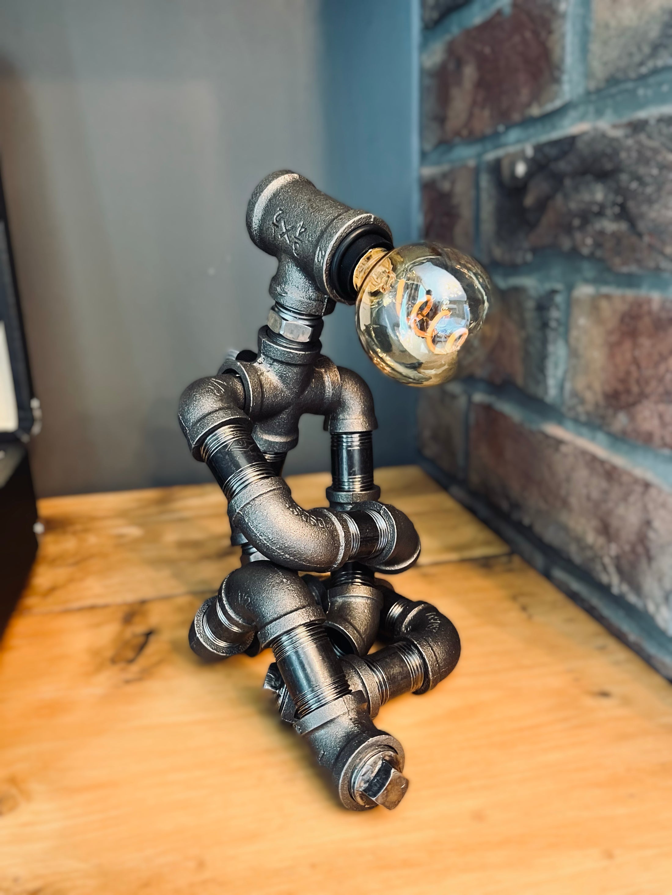 The Thinking Man Industrial Style Iron Pipe Person Lamp & Vintage Bulb ...