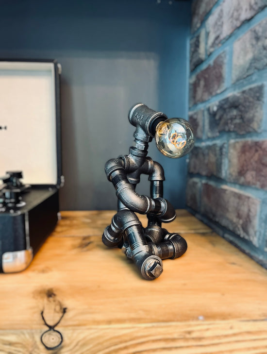 The Thinking Man Industrial Style Iron Pipe Person Lamp & Vintage Bulb ...